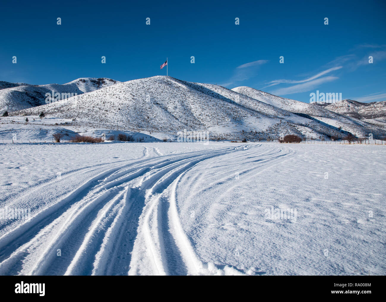 American Flag waves proudly on a snowy hillside Stock Photo - Alamy