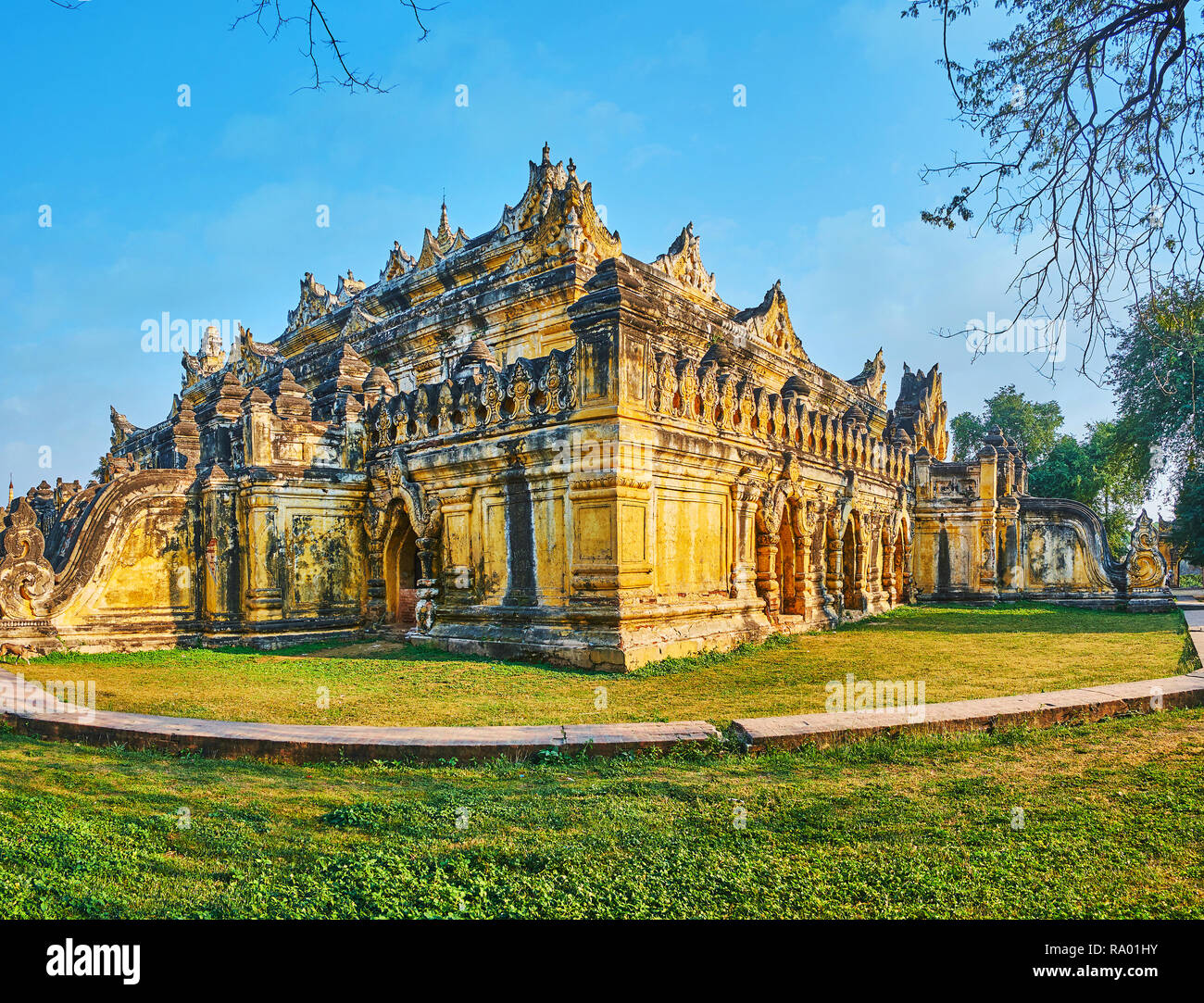 The richly decorated old building of Maha Aungmye Bonzan Monastery ...