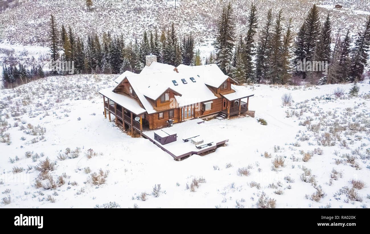 Aerial view of the mountain house covered in snow in the Winter Stock ...