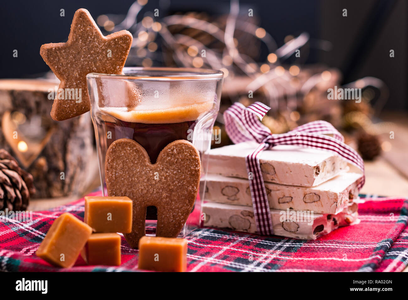 Fresh aromatic coffee and Italian Christmas sweets. Nougat with almonds ...
