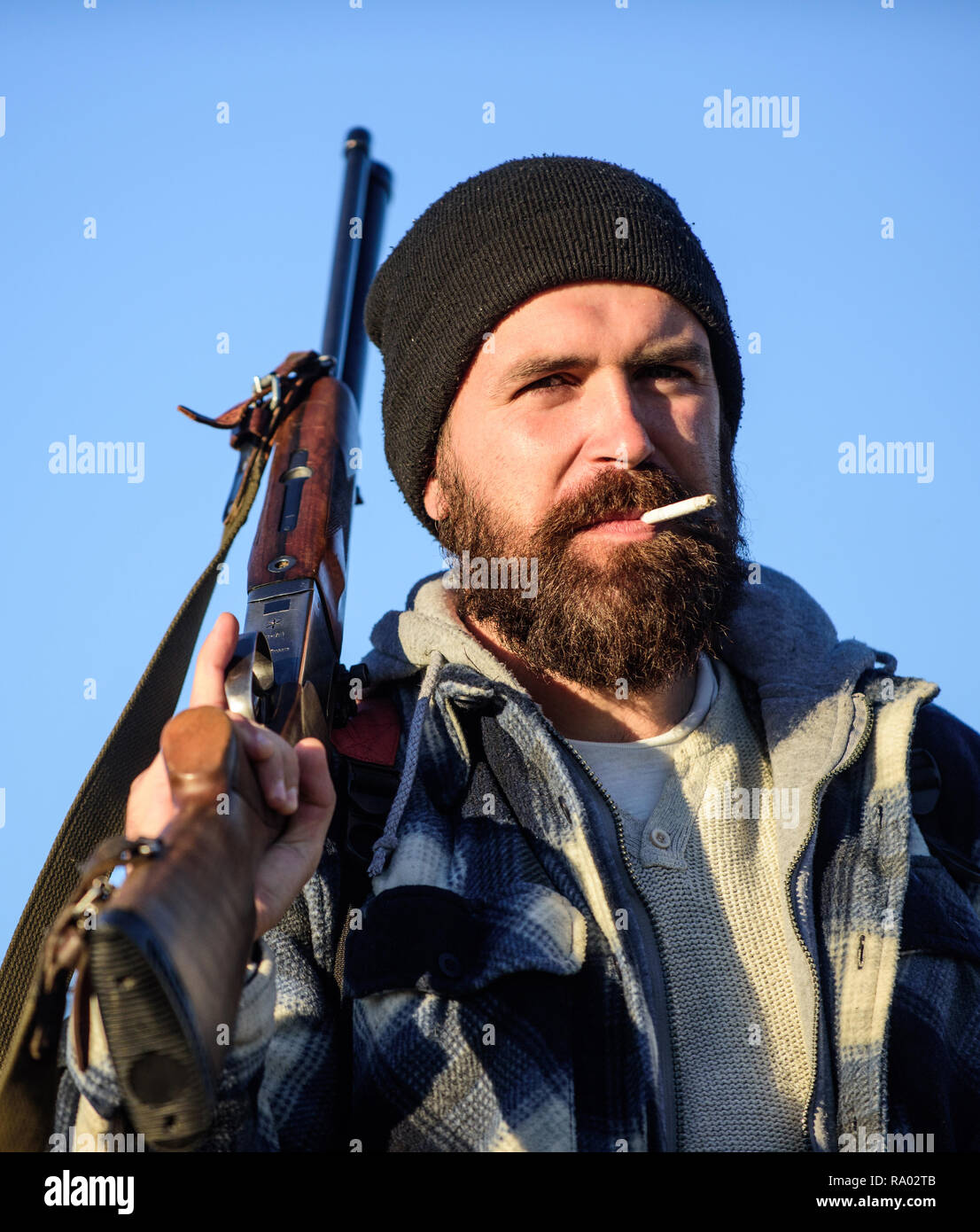 Hunter with rifle gun close up. Guy bearded hunter spend leisure ...