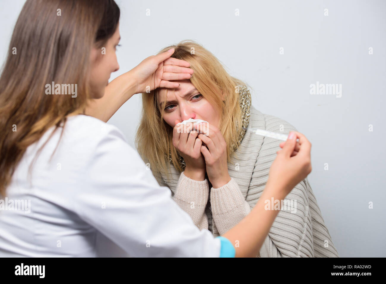 Treatment and when to call doctor. Doctor woman examine sick person ...