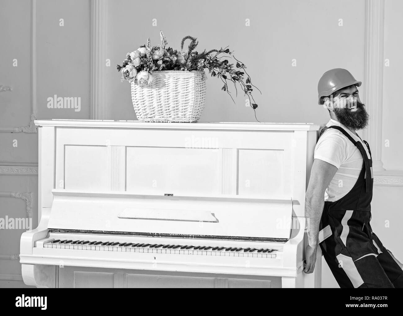 Courier delivers furniture, move out, relocation. Man with beard worker ...