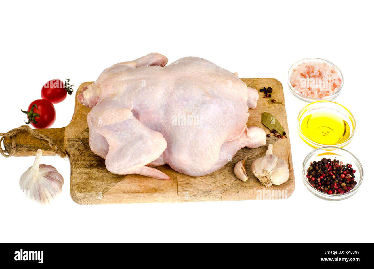 Raw chicken meat with vegetables and spices on cutting board, prepared ...