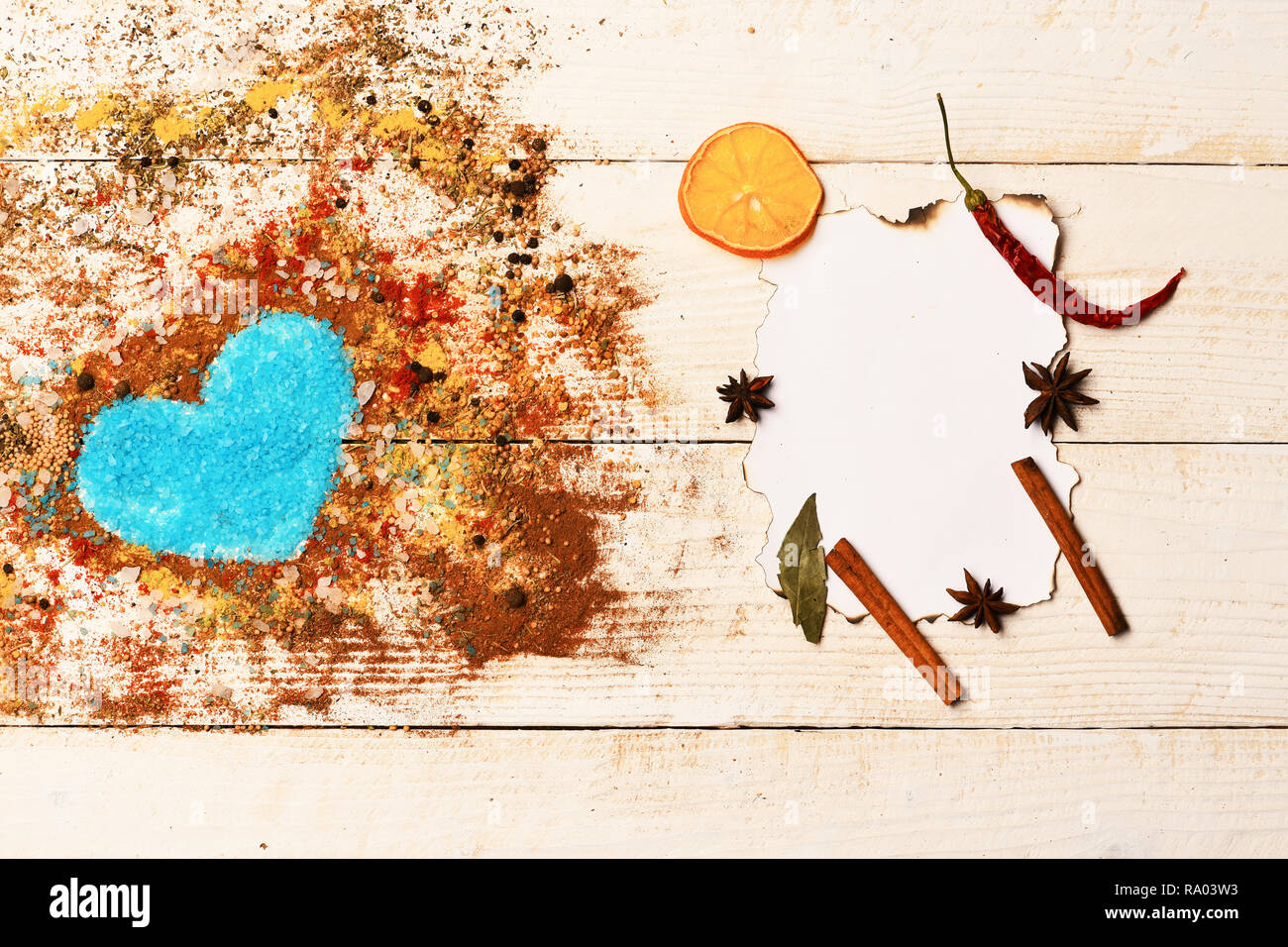 Food art concept. Set of spices on beige wooden background. Composition ...