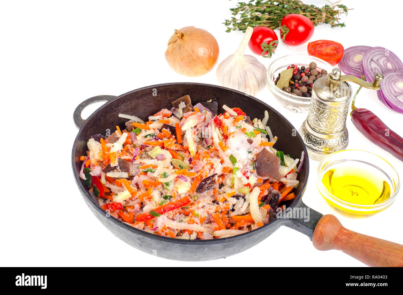 Frozen vegetables in apan, spices for cooking. Studio Photo Stock Photo ...