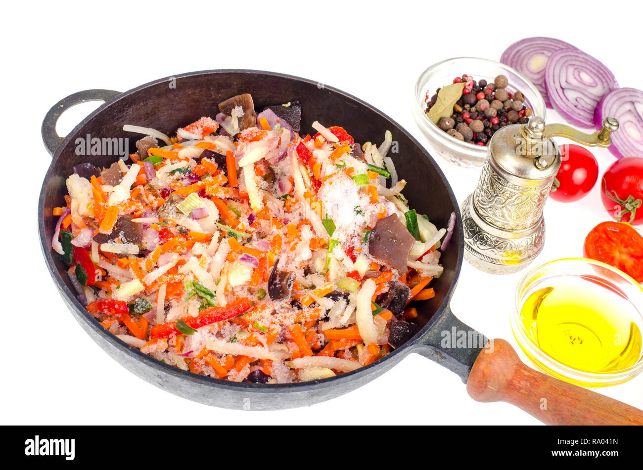 Frozen vegetables in apan, spices for cooking. Studio Photo Stock Photo ...
