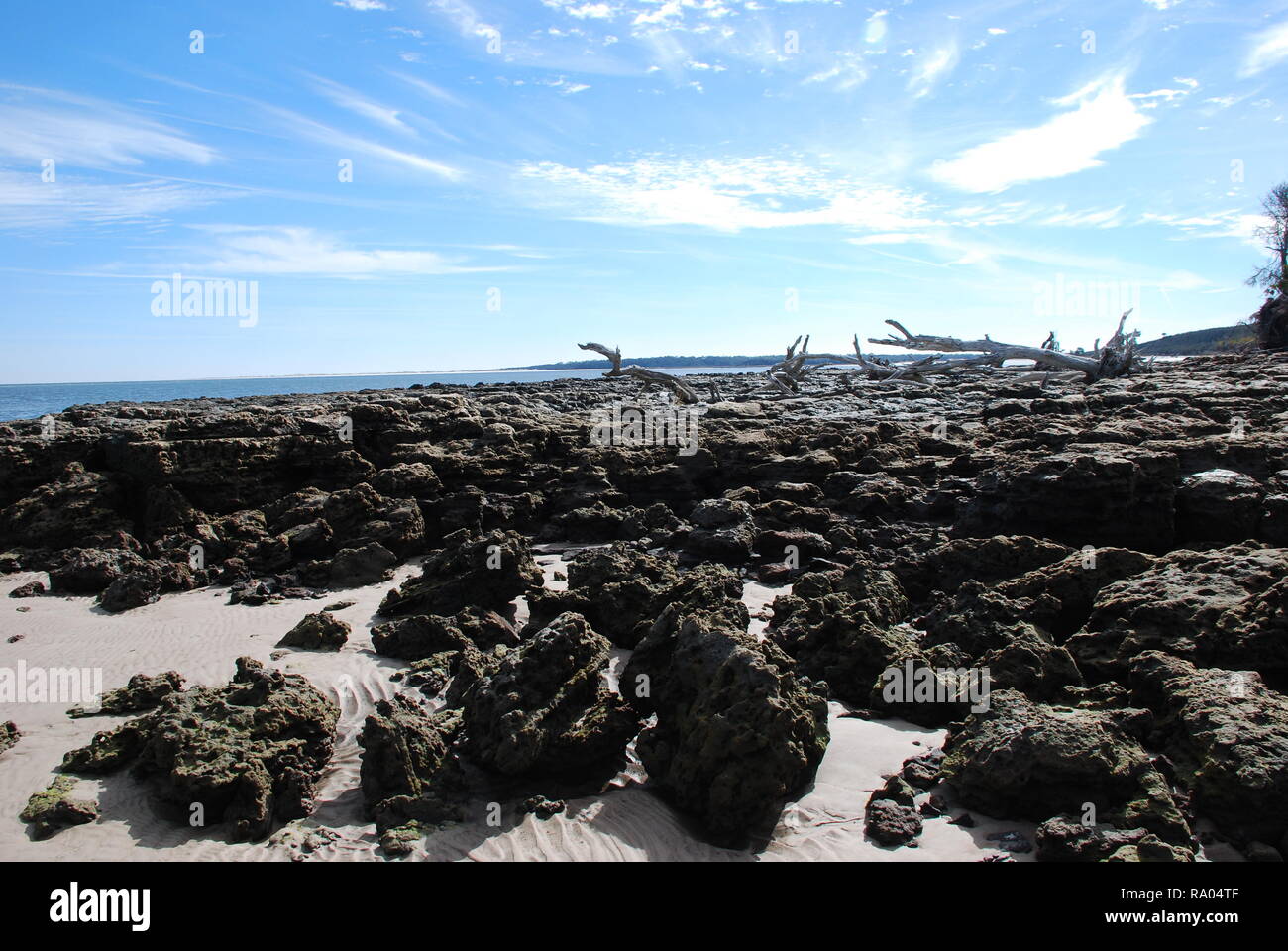 Rock in ocean on beach hi-res stock photography and images - Alamy