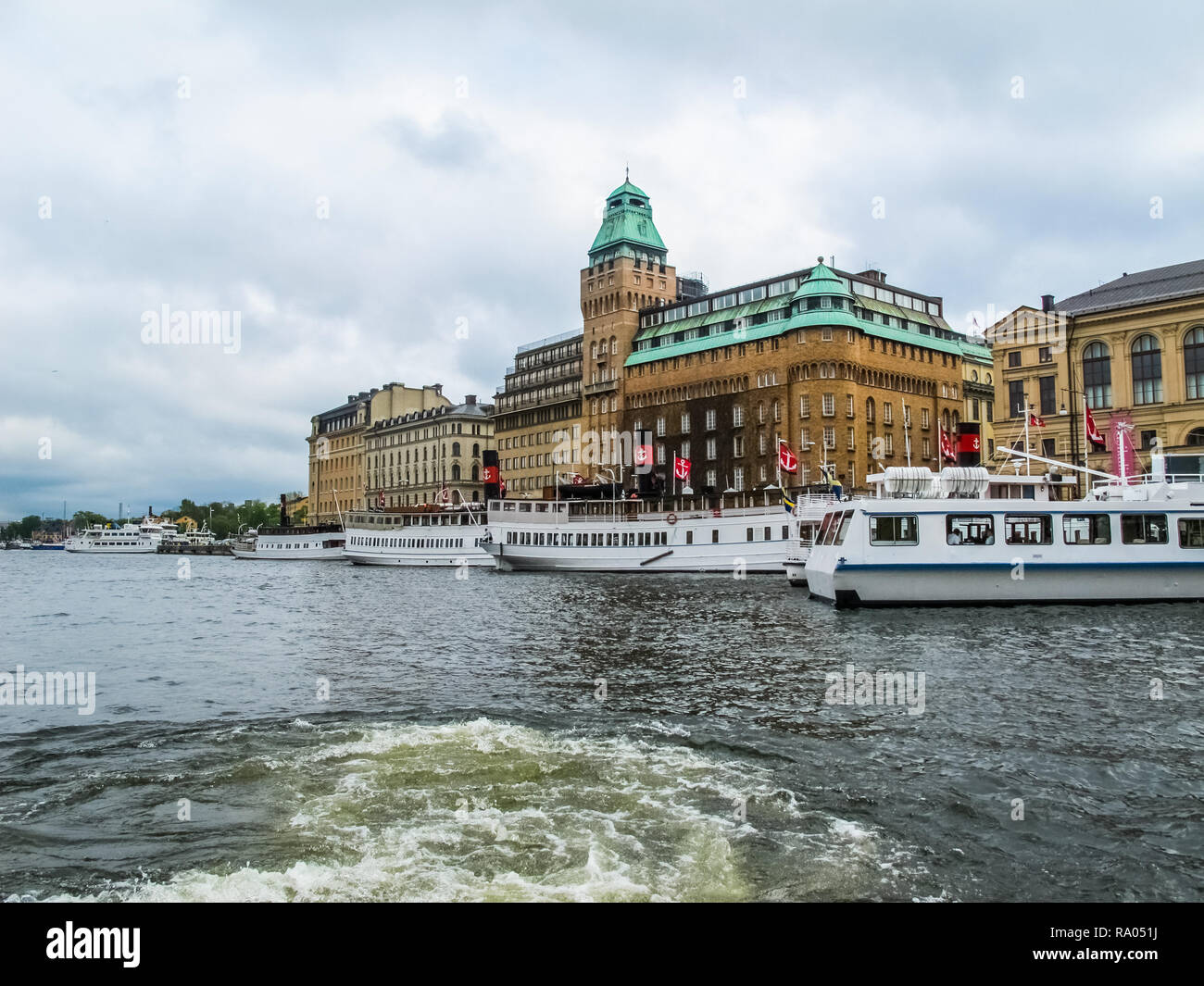 Panoramic view from the tourist excursion boat to the pier with boats ...