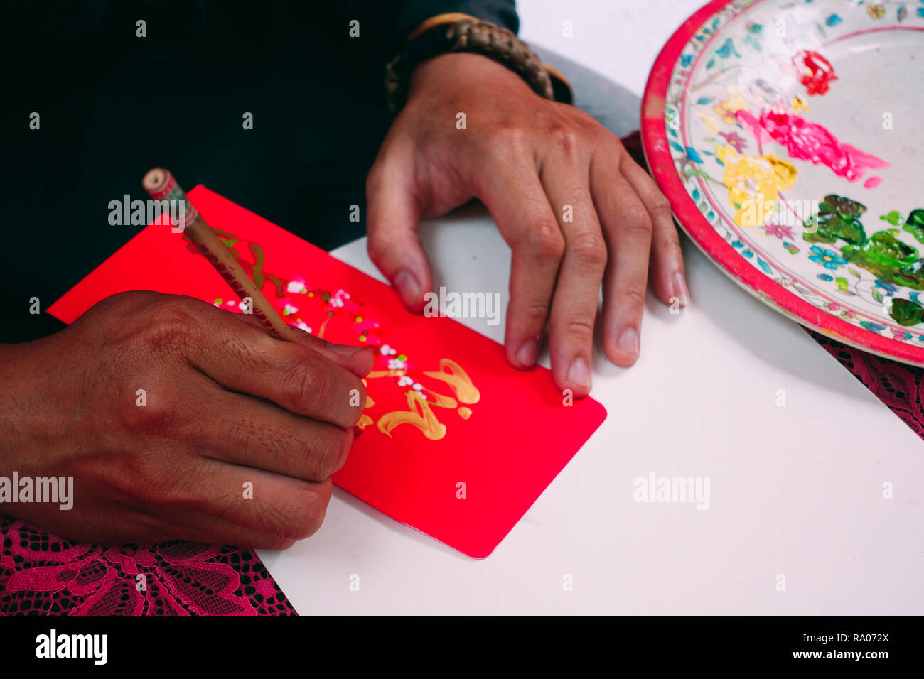 Vietnamese scholar writes calligraphy at lunar new year. Calligraphy ...