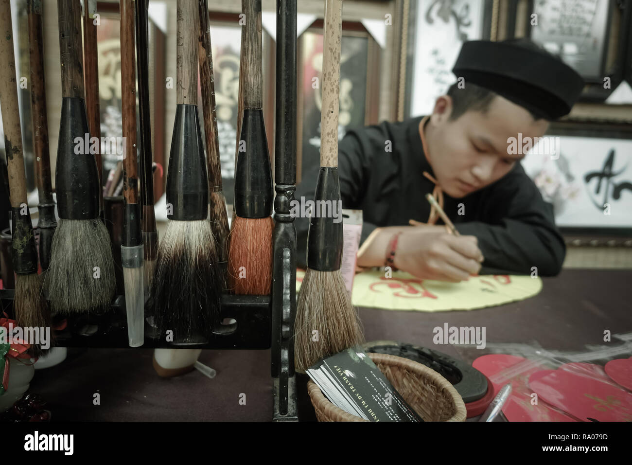 Vietnamese scholar writes calligraphy at lunar new year. Calligraphy ...