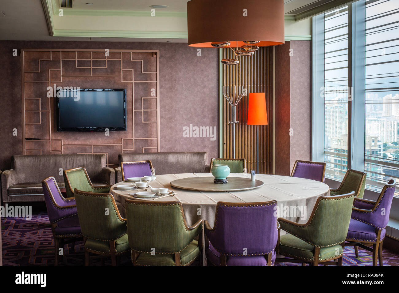 beautiful restaurant interior with round tables and colourful seating ...