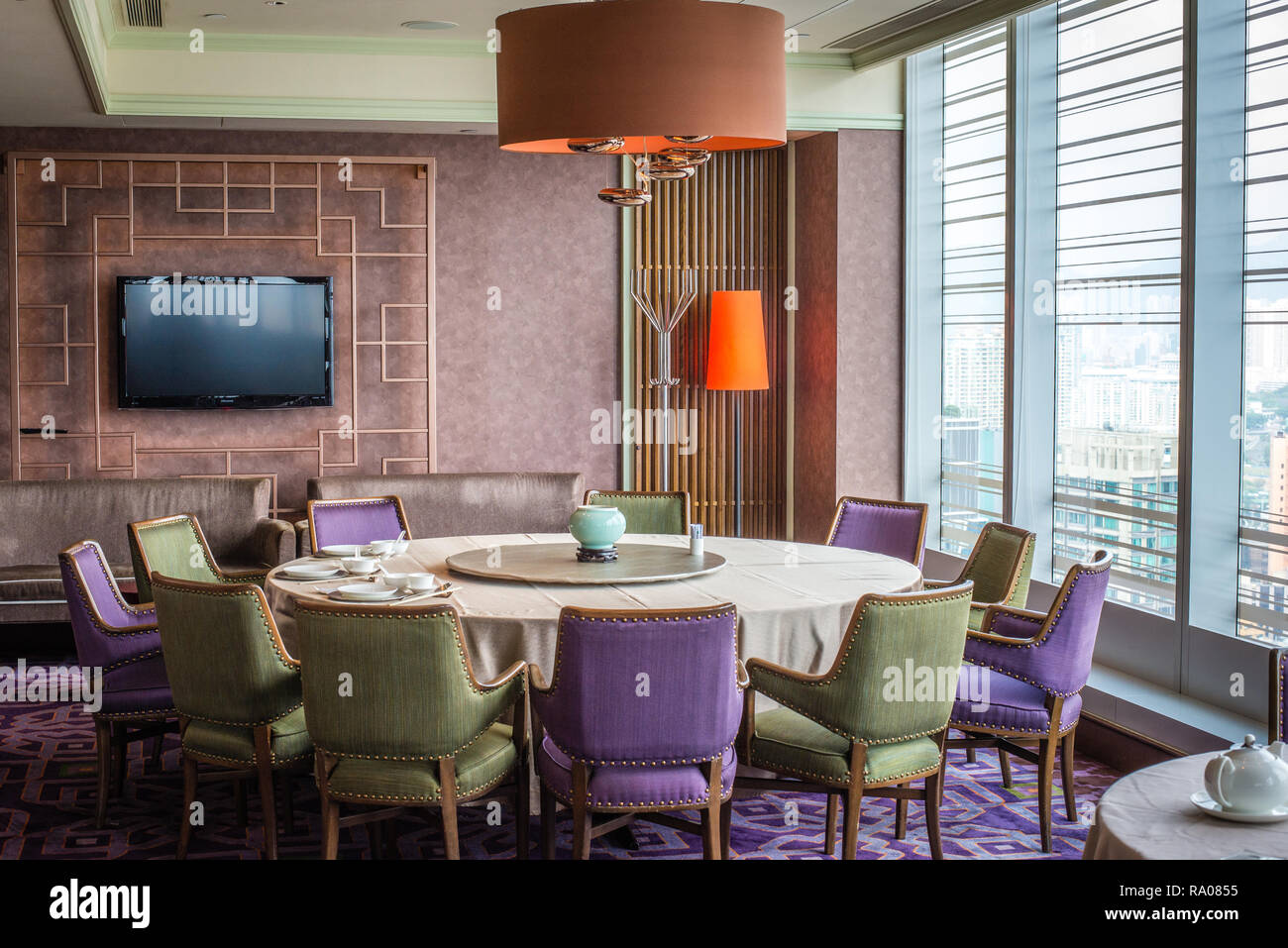 beautiful restaurant interior with round tables and colourful seating ...