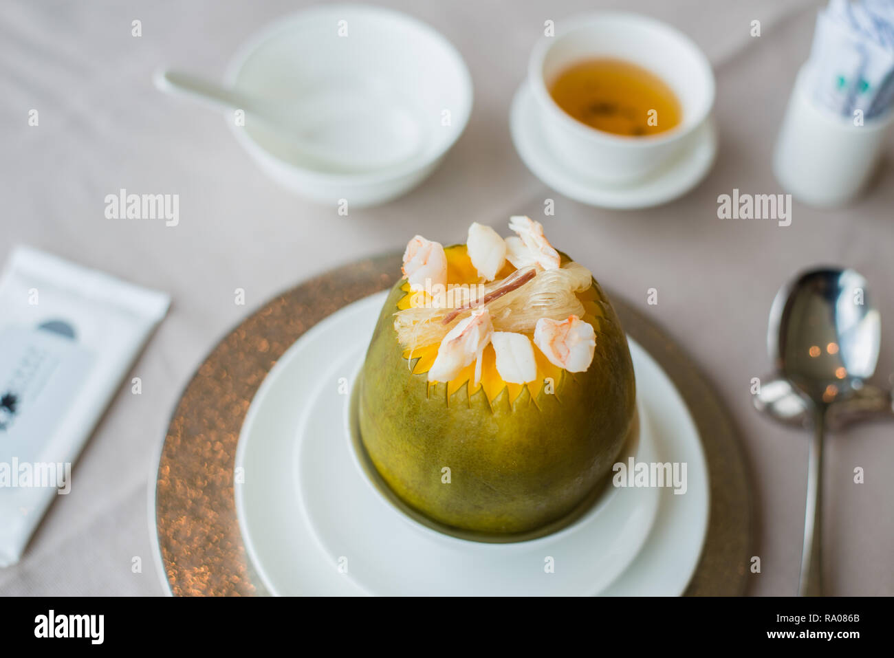 Double boiled 4 treasure soup in papaya Stock Photo - Alamy