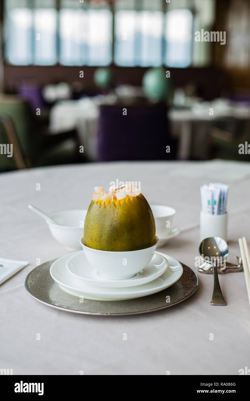 Double boiled 4 treasure soup in papaya Stock Photo - Alamy