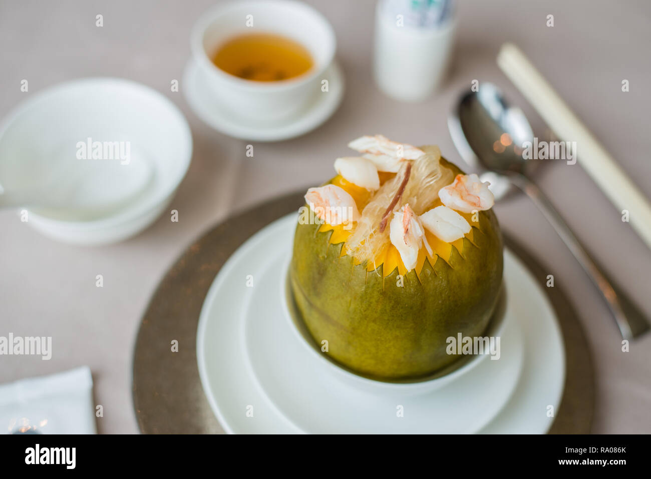 Double boiled 4 treasure soup in papaya Stock Photo - Alamy