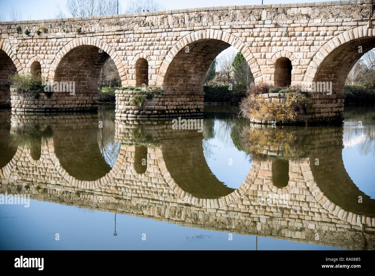 Roman bridge over guadiana river in merida hi-res stock photography and ...