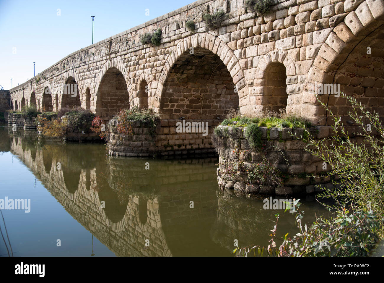 Roman bridge over guadiana river in merida hi-res stock photography and ...