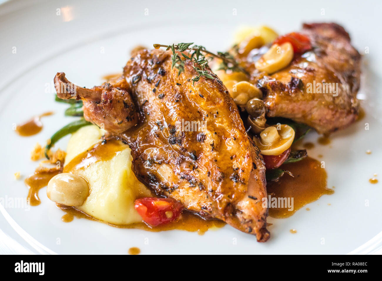 Grilled Poulet creamy mashed purple yam and sautéed vegetables Stock ...