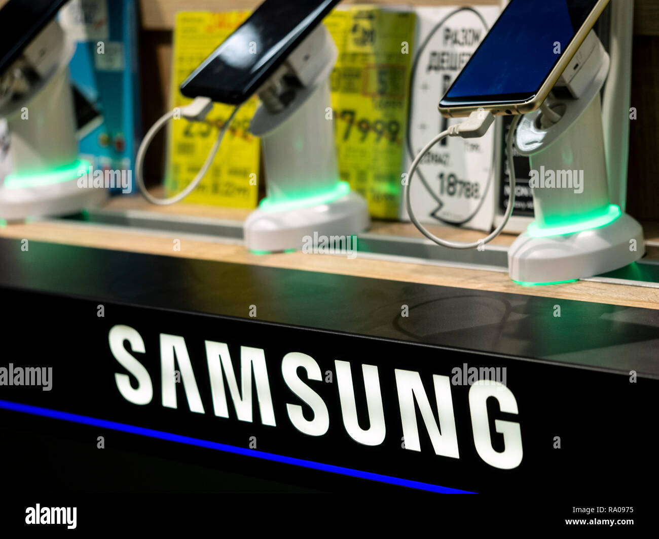 Samsung logo at the shelf with smartphones in the store Stock Photo - Alamy