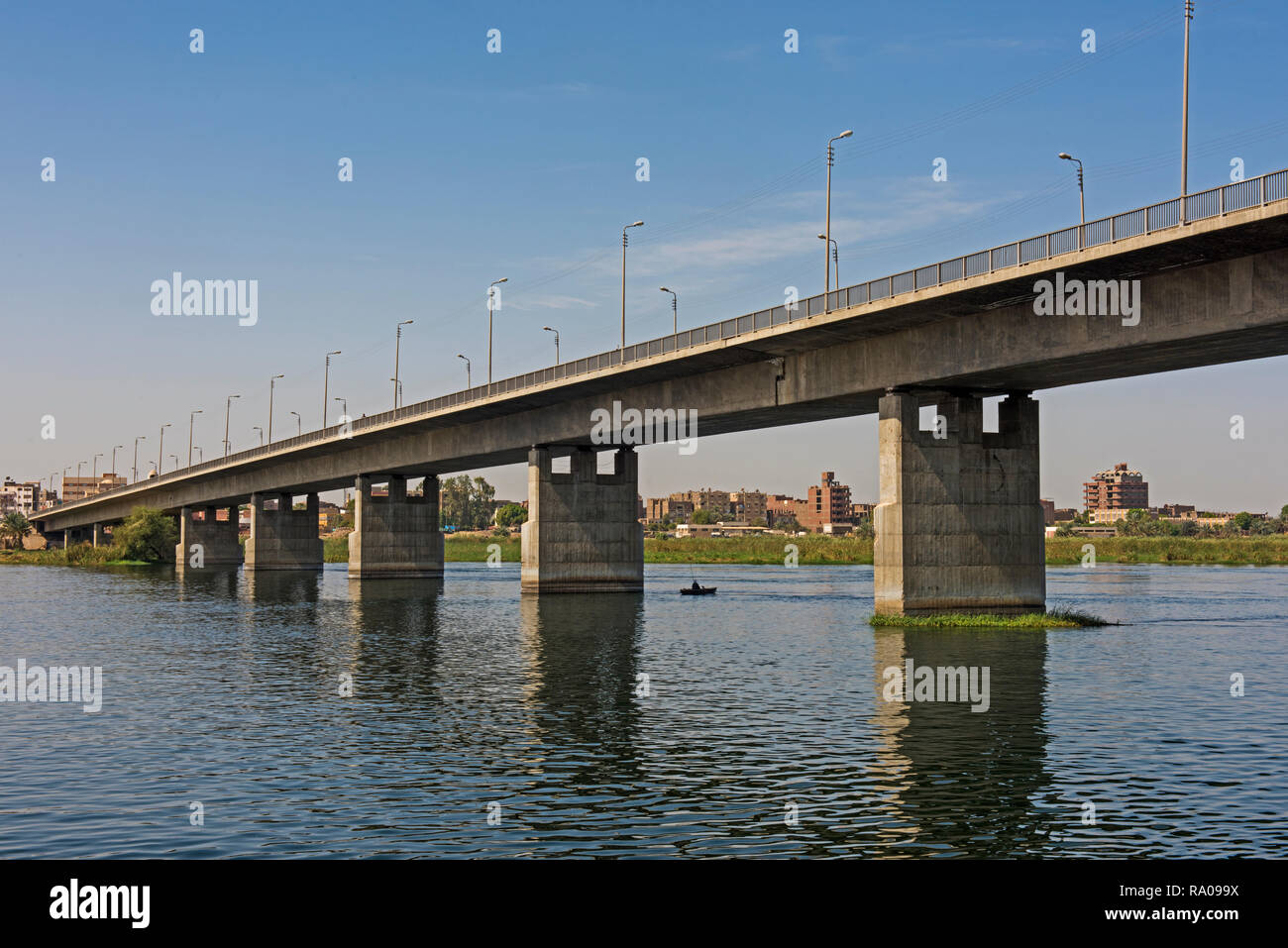 Panoramic view of large concrete road bridge spanning large wide nile ...