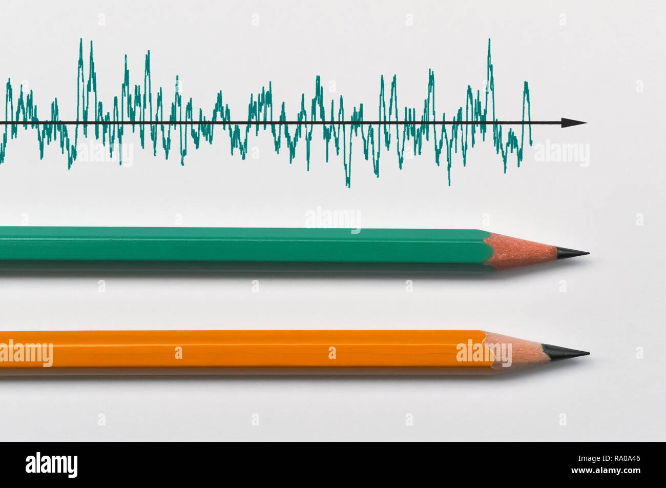 Two pencils and a real time graph on bright background Stock Photo - Alamy