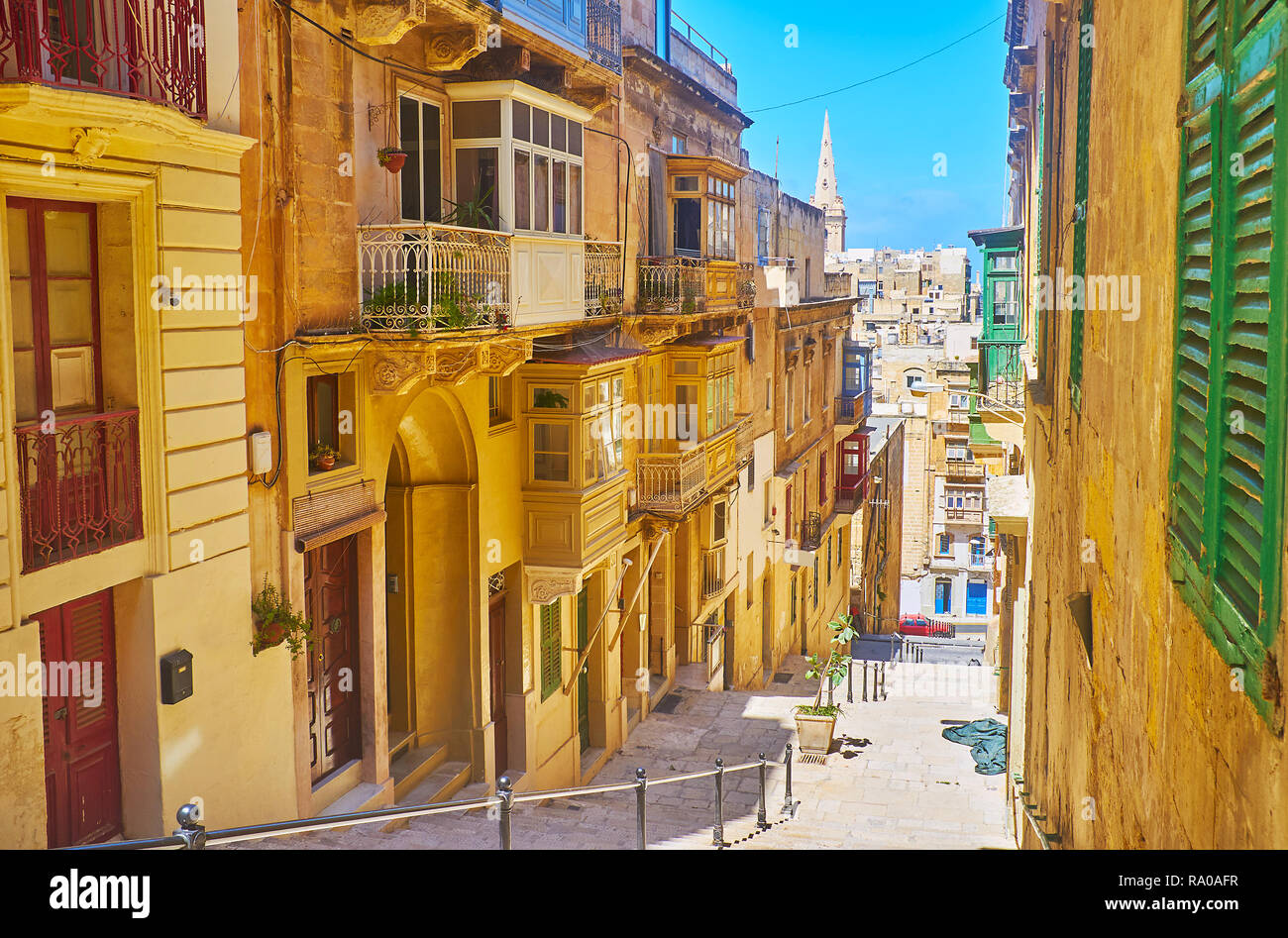 Walk down the stairs in Vassali street with scenic Maltese edifices ...