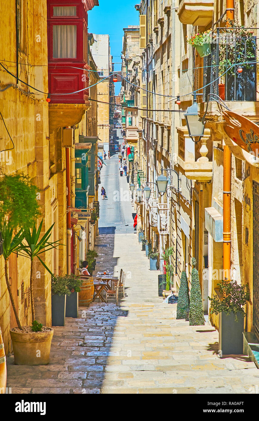 VALLETTA, MALTA - JUNE 18, 2018: Walk the legendary Strait street - the ...