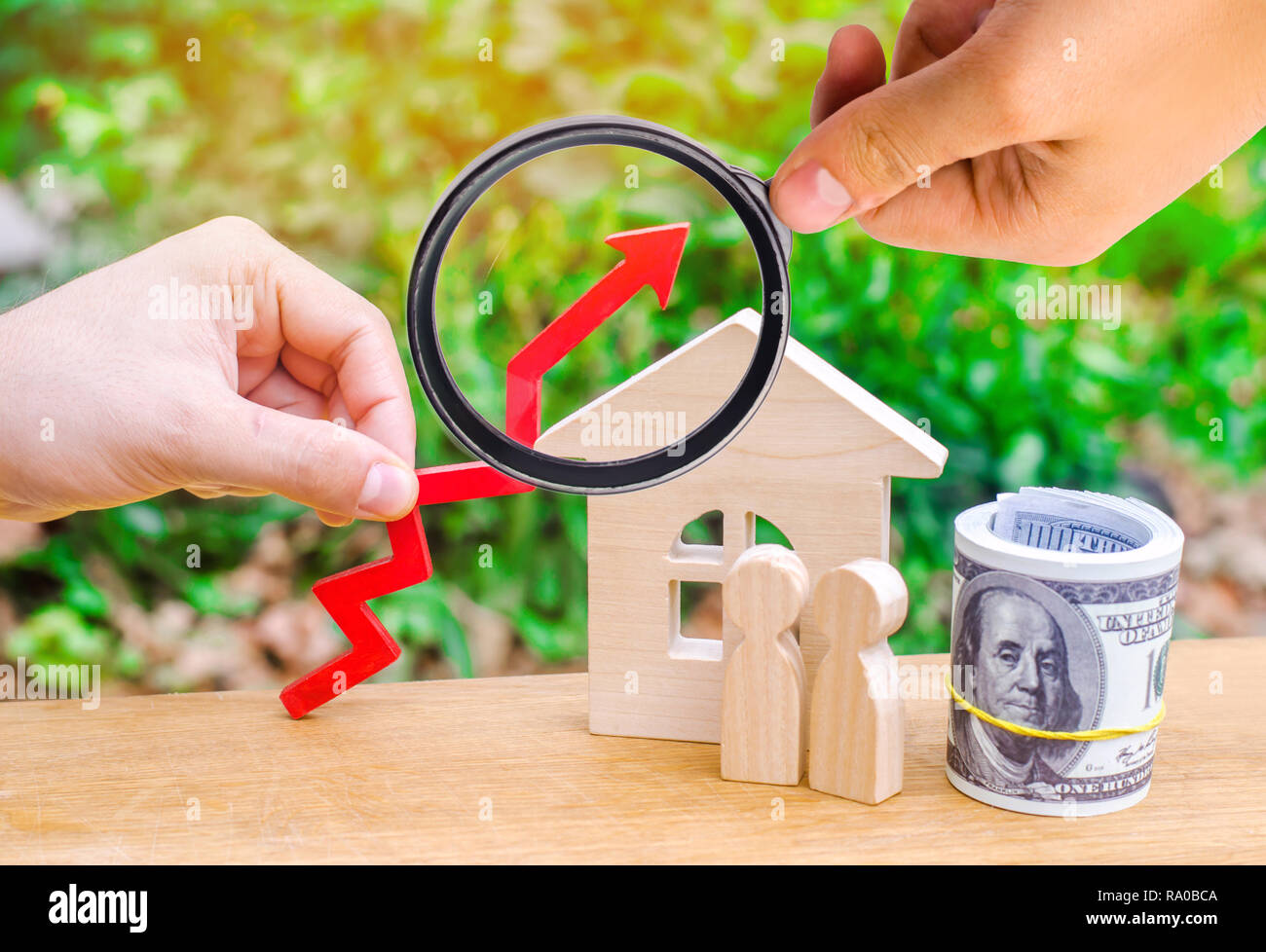 wooden house, money with a red arrow up. concept of high demand for ...