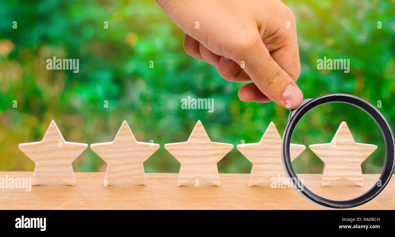 Five wooden stars. Get the fifth star. The concept of the rating of ...
