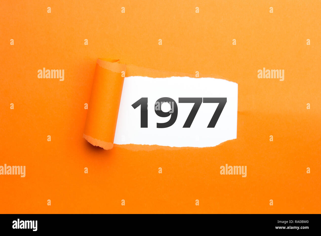 surprising Number / Year 1977 orange background Stock Photo - Alamy