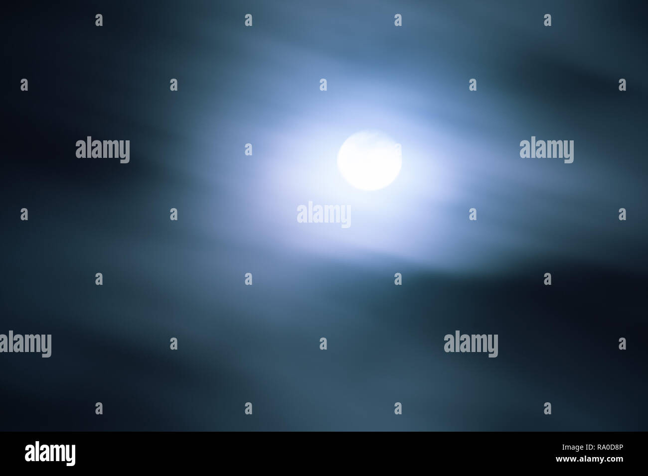 Full moon shining behind fast moving clouds; movement blur Stock Photo ...