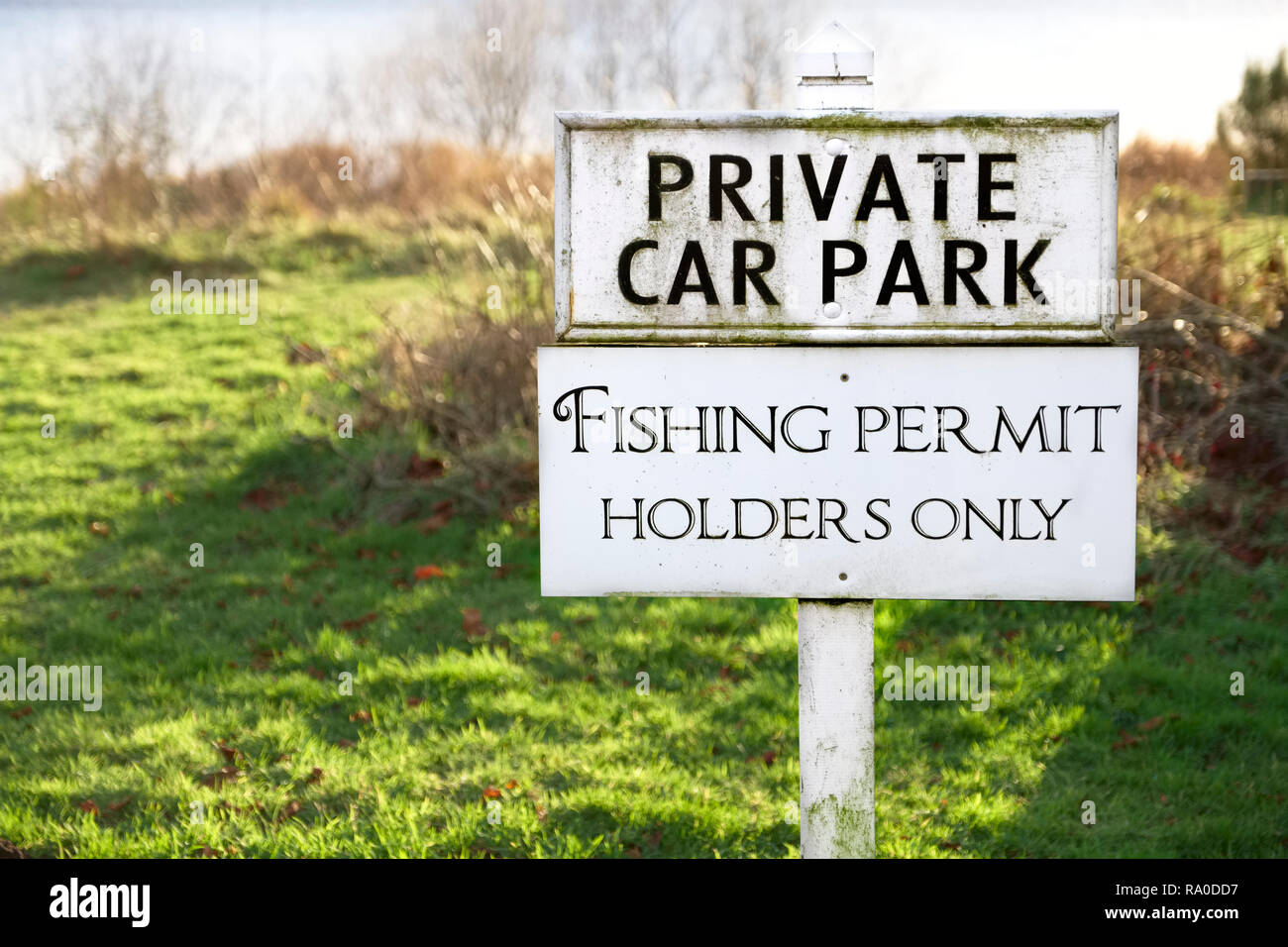 Fishing permit holders only sign post and private car park Stock Photo ...