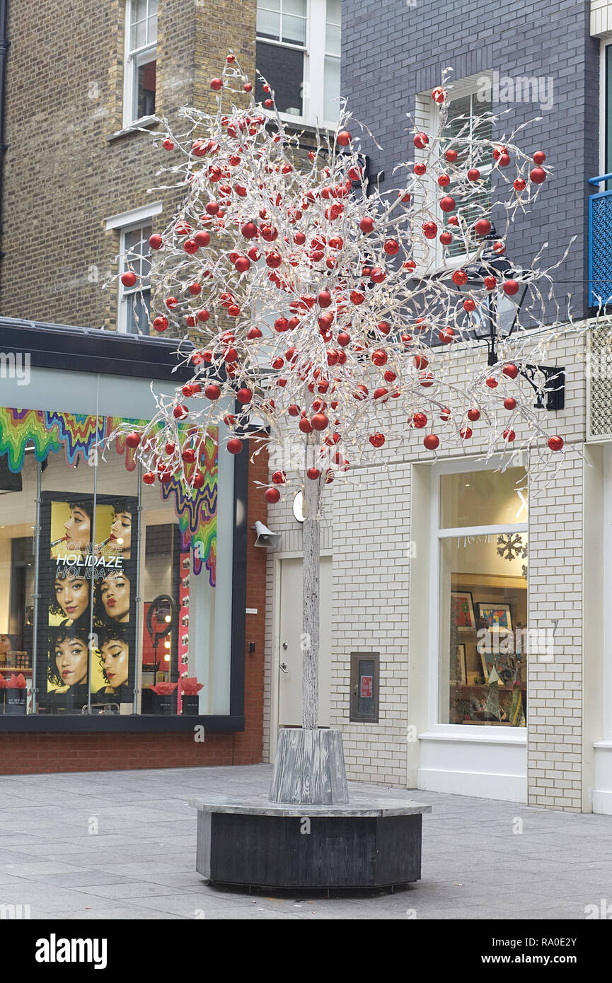 Christmas tree decorated with baubles and lights for Christmas in ...