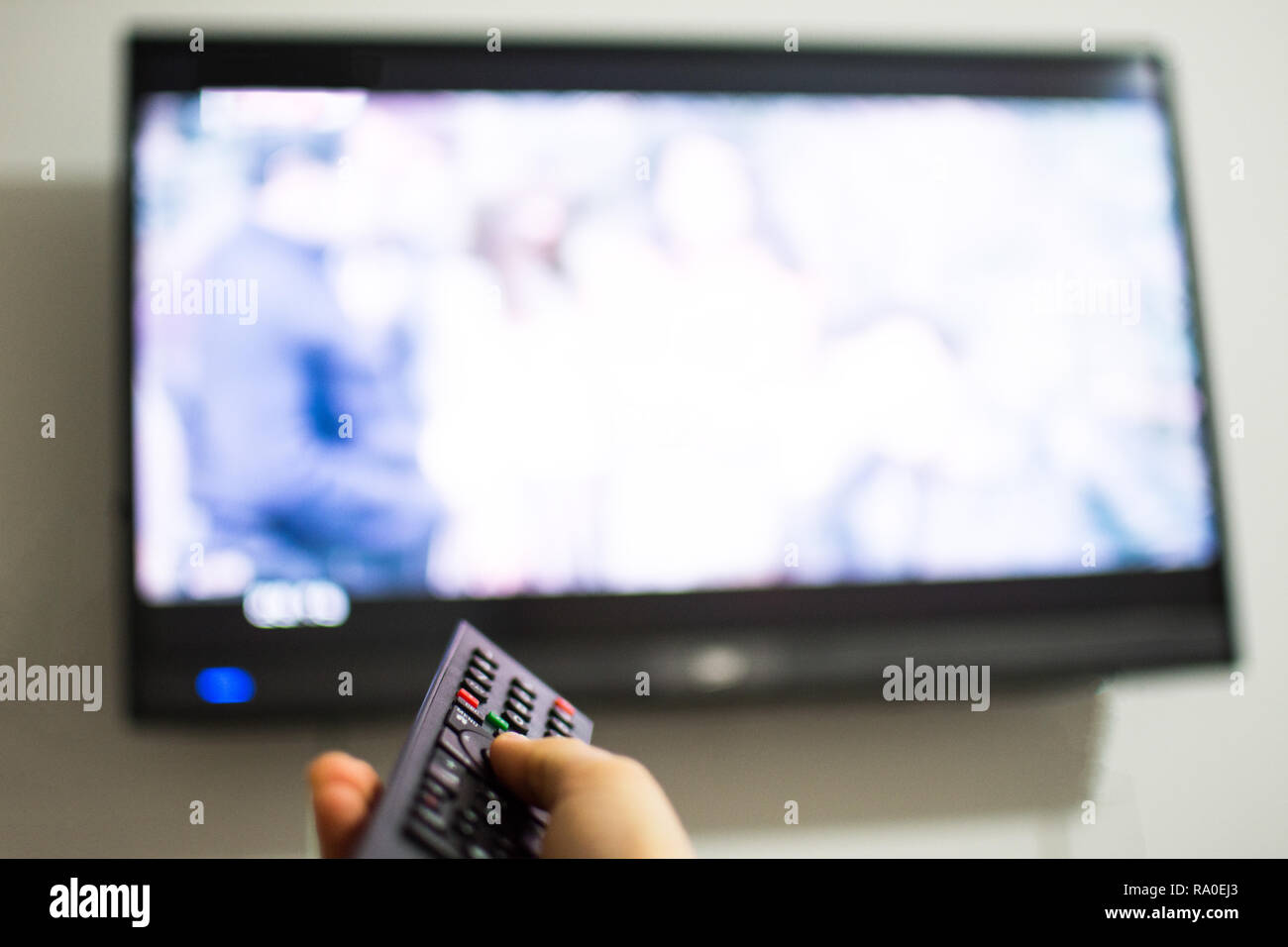 man hand changing channels on the modern TV Stock Photo - Alamy