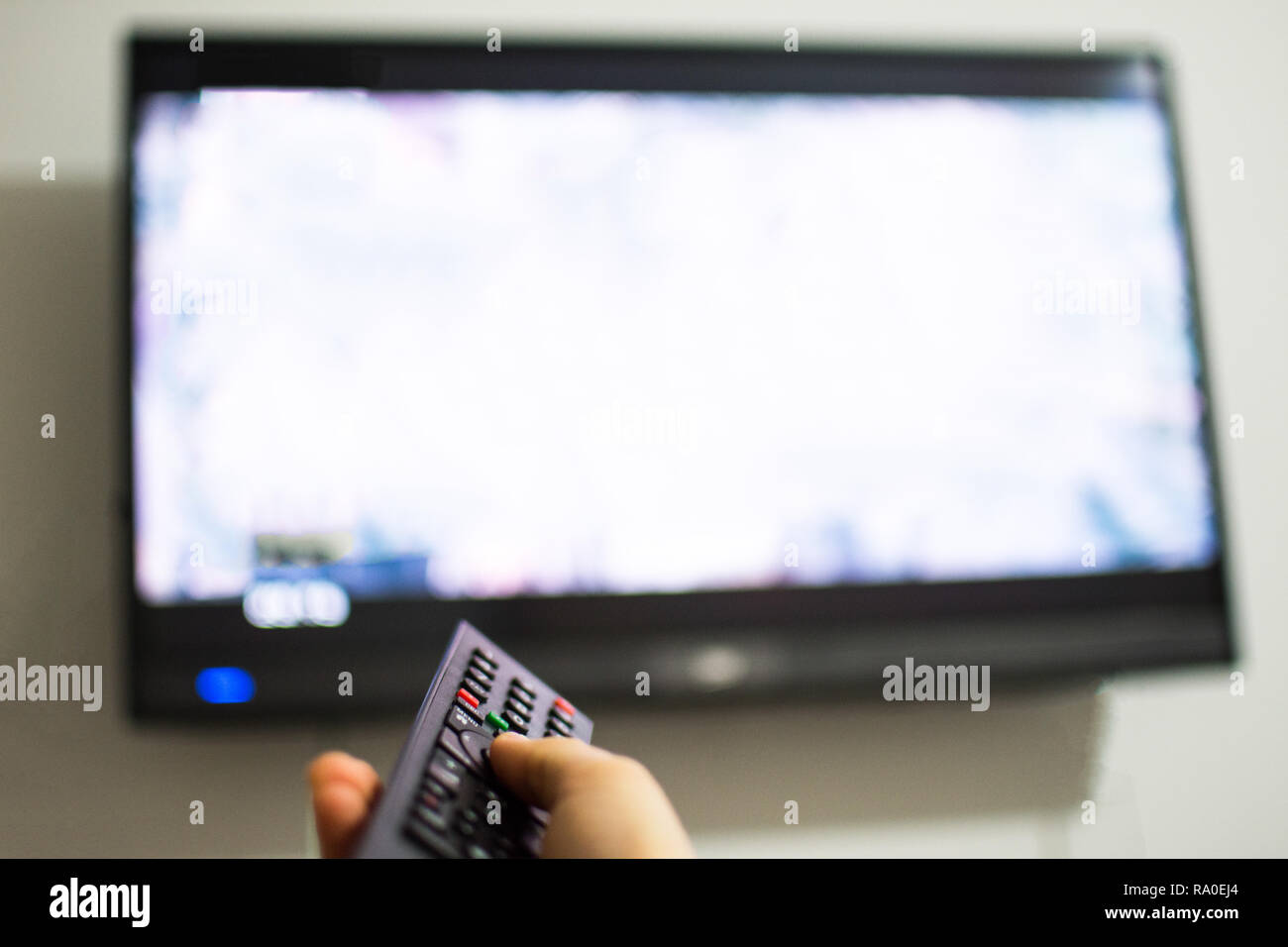 man hand changing channels on the modern TV Stock Photo - Alamy