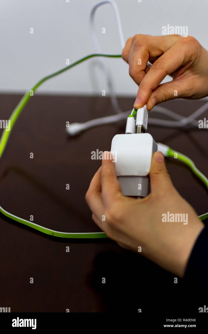 Hand connect two usb cables hi-res stock photography and images - Alamy