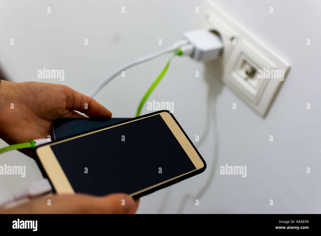 Phones plugged into socket hi-res stock photography and images - Alamy
