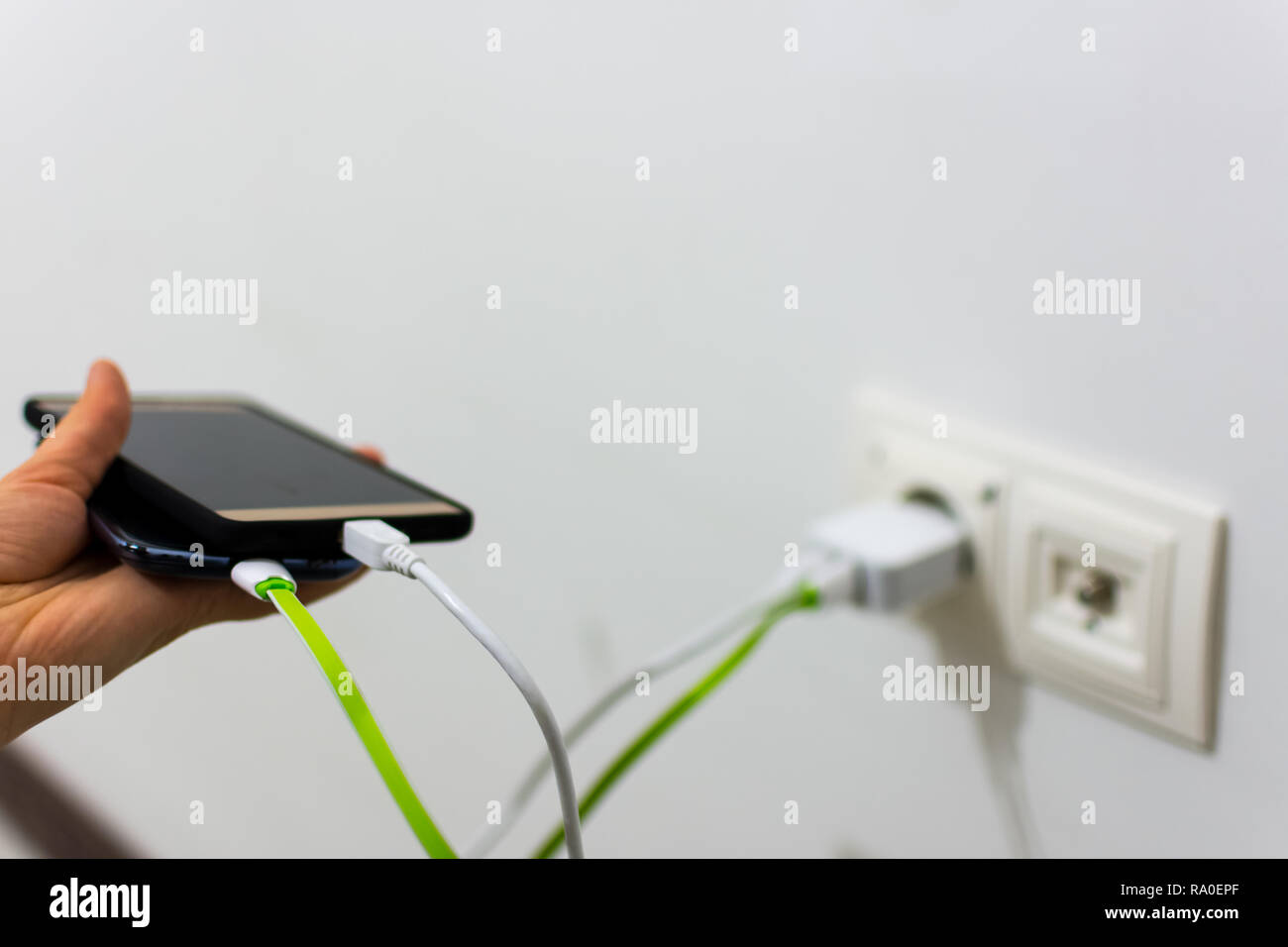 Phones plugged into socket hi-res stock photography and images - Alamy