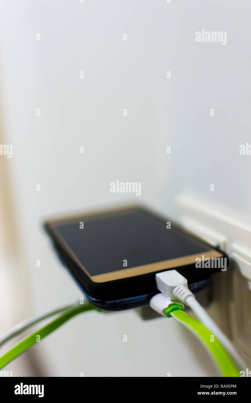 Phones plugged into socket hi-res stock photography and images - Alamy