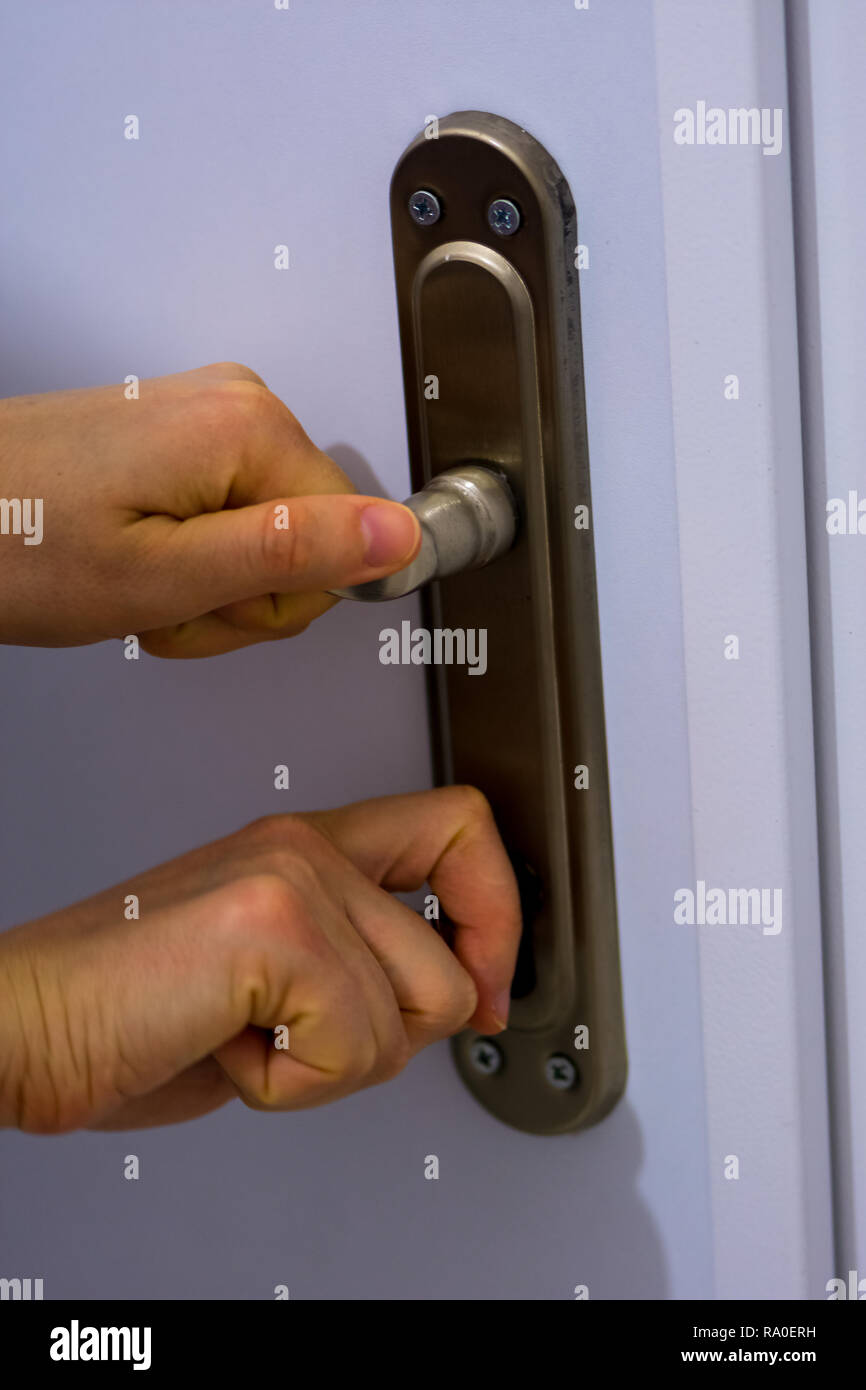 Female locking door hi-res stock photography and images - Alamy