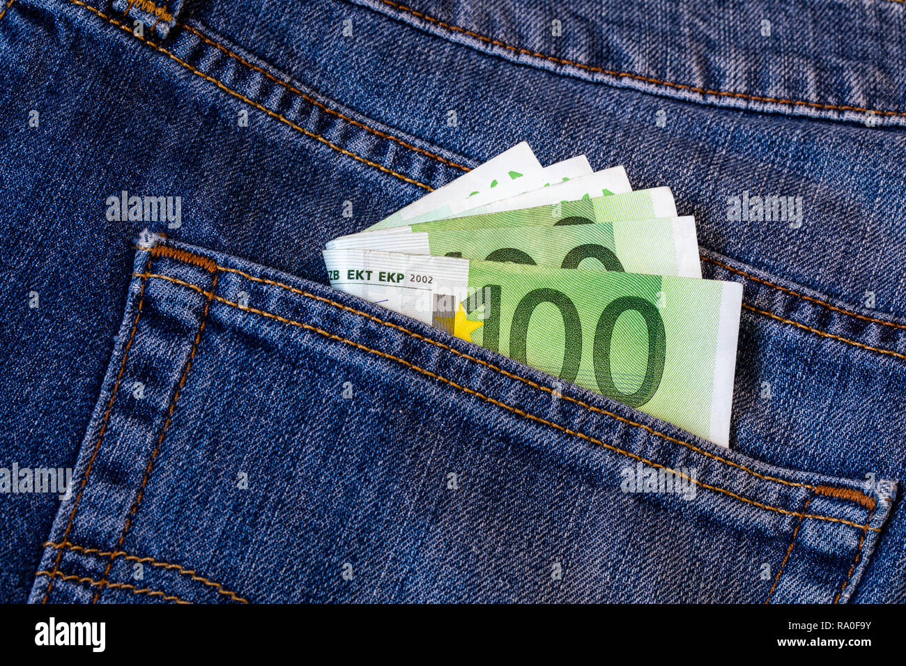 Money falling out of pocket hi-res stock photography and images - Alamy