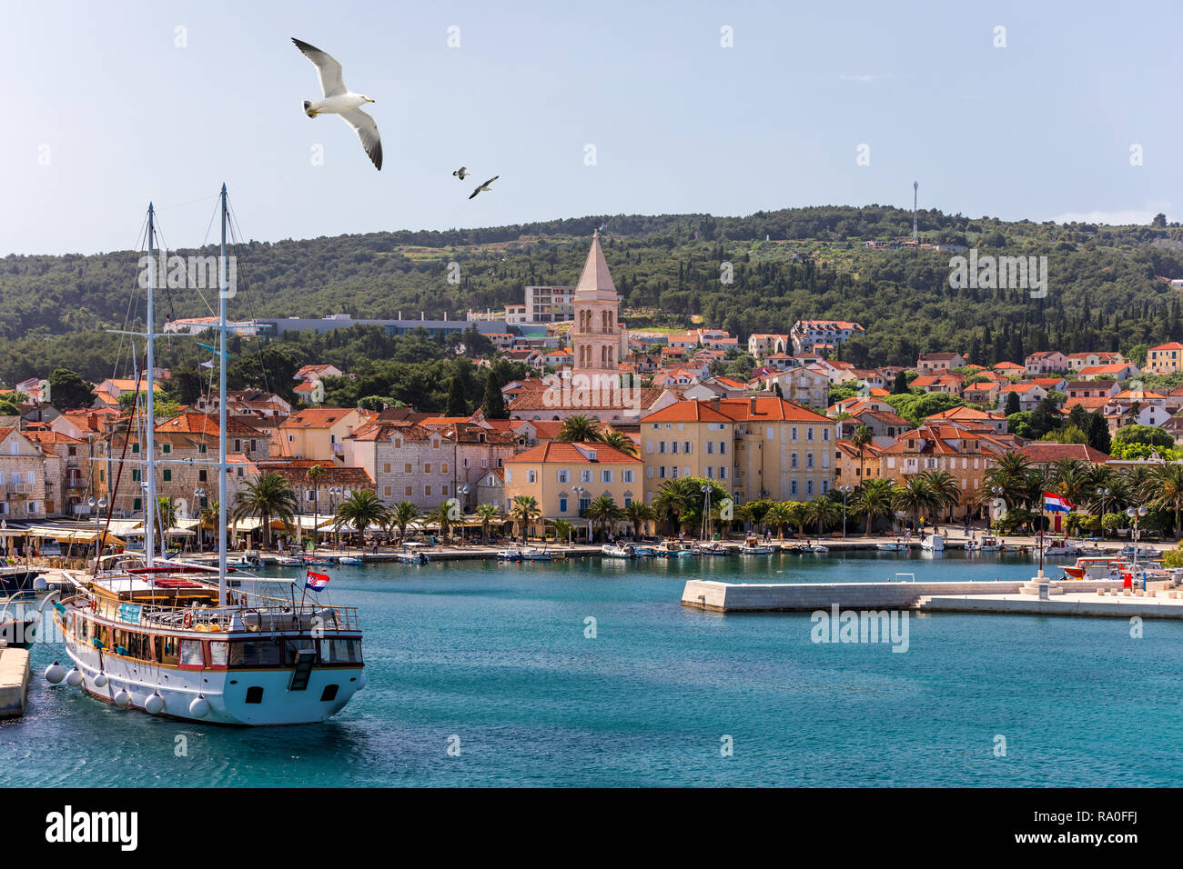 Supetar city in Brac island, Croatia. View from the sea. Picturesque ...