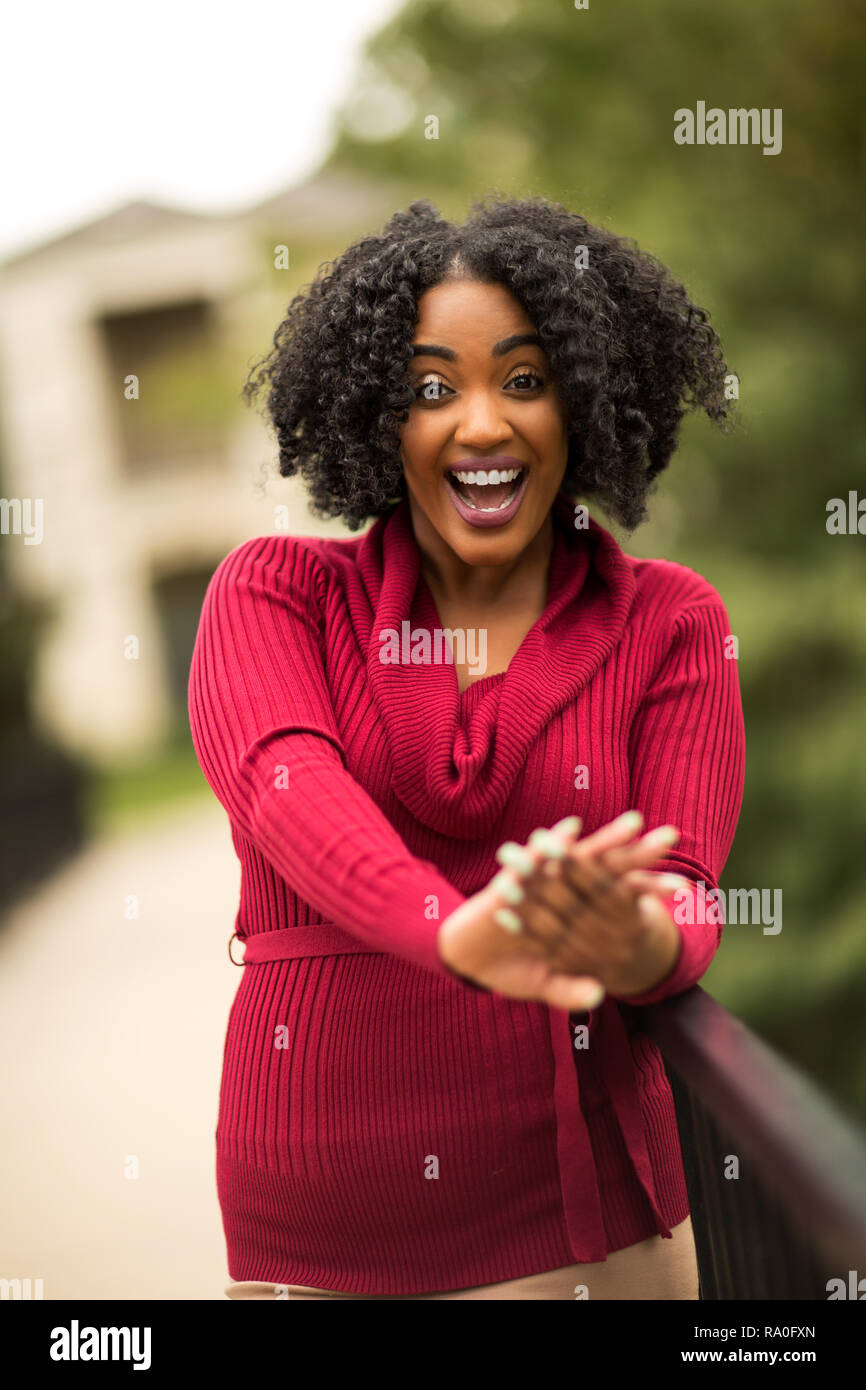 Beautiful woman smiling looking at her engagement ring Stock Photo - Alamy