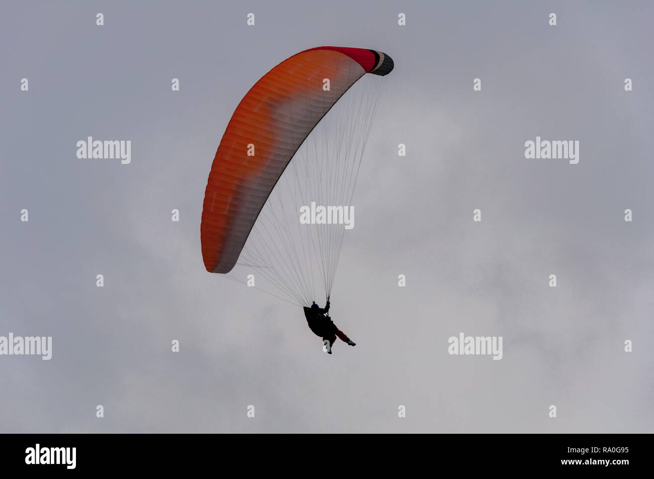 Image of parachute with parachutist skydiver in the sky Stock Photo - Alamy