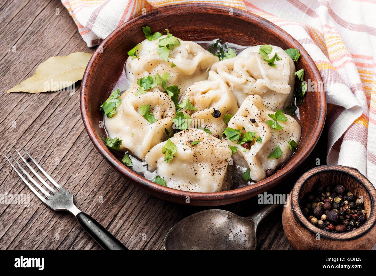 Traditional Russian dish pelmeni.Meat dumplings on wooden rustic ...
