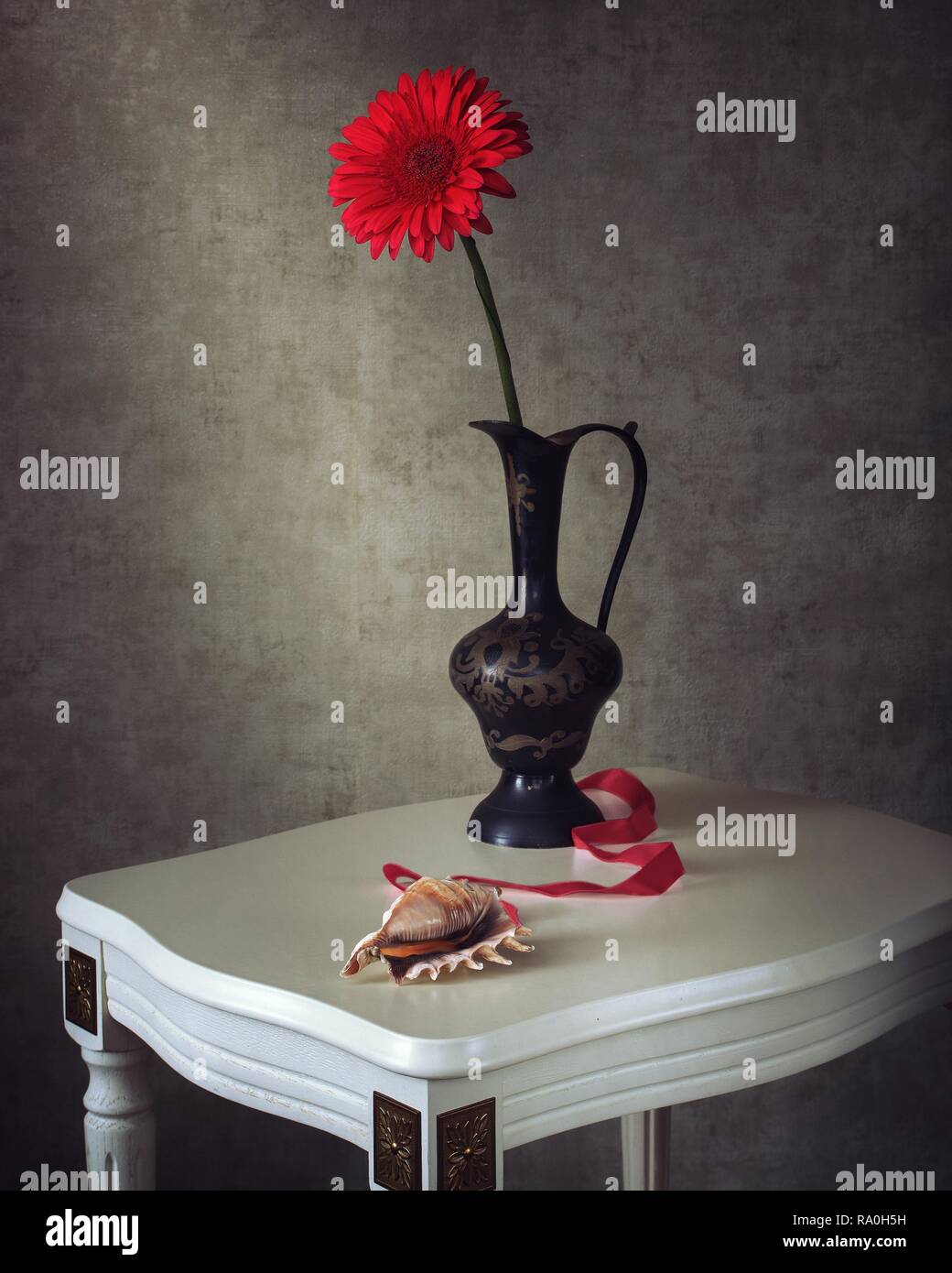 Still life with red gerbera flower Stock Photo - Alamy