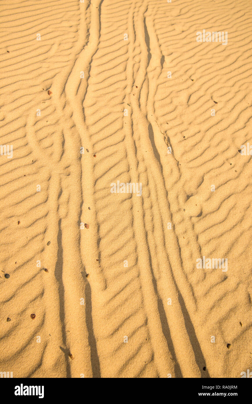 Sand of a beach with tracks Stock Photo - Alamy