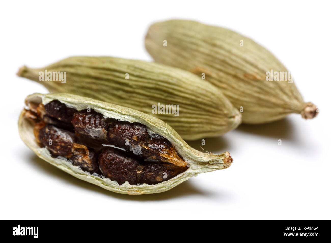 Green cardamom pods and seeds isolated on white background Stock Photo ...