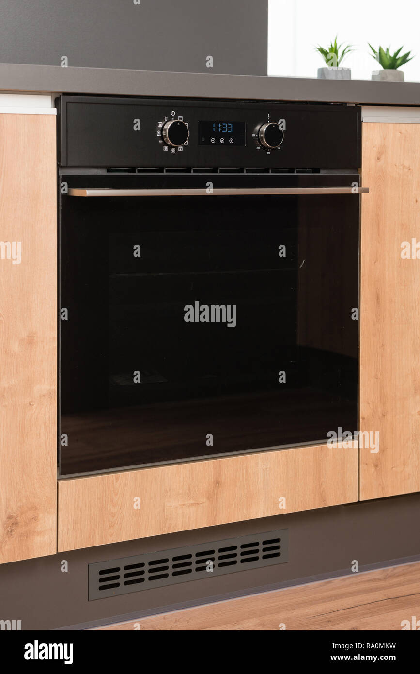 New electric stove with induction cooktop in contemporary kitchen Stock ...